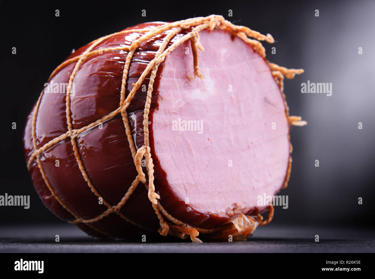 Composition with piece of ham. Meatworks products Stock Photo - Alamy