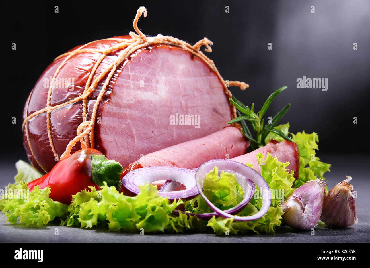 Composition with piece of ham. Meatworks products Stock Photo - Alamy
