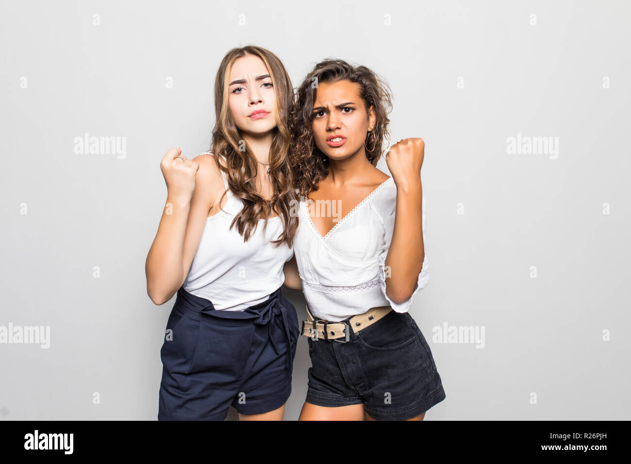 Two trendy young women hugging hi-res stock photography and images - Alamy