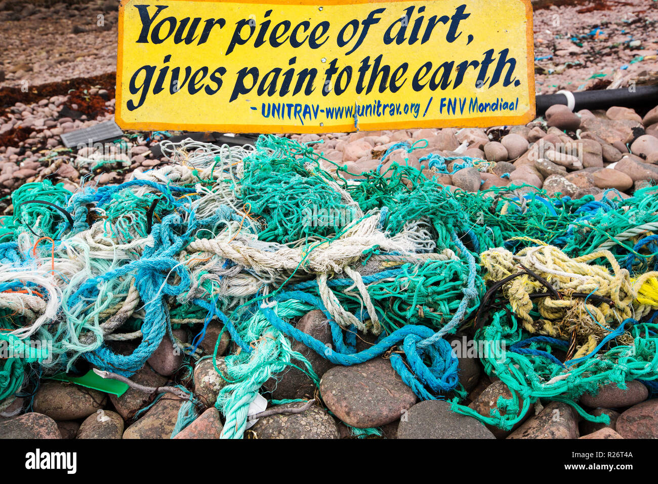 Fishing netting and other plastics in the tide wrack, washed ashore on ...