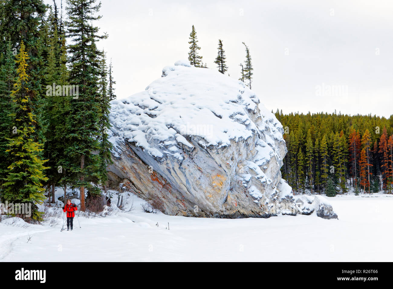 42,755.09705 woman person cold winter hike Maligne Lake with huge 30 ft ...