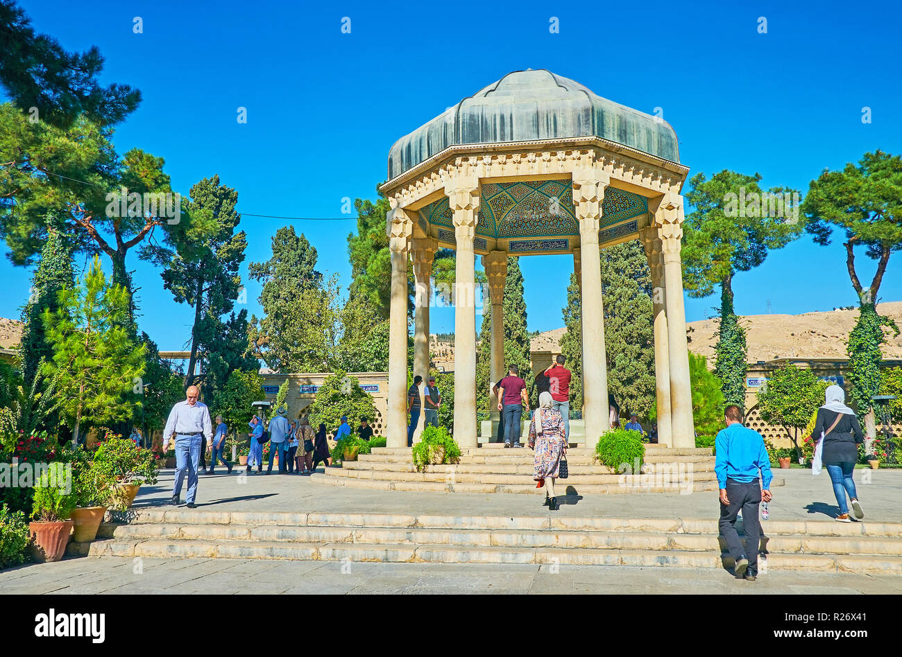 SHIRAZ, IRAN, OCTOBER 13, 2017: The visitors of Hafez Tomb walk in ...