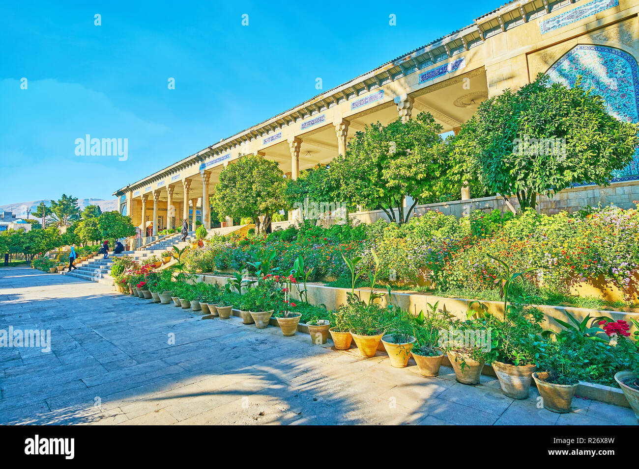 The beautiful flower beds and colored flowers in pots decorate the ...