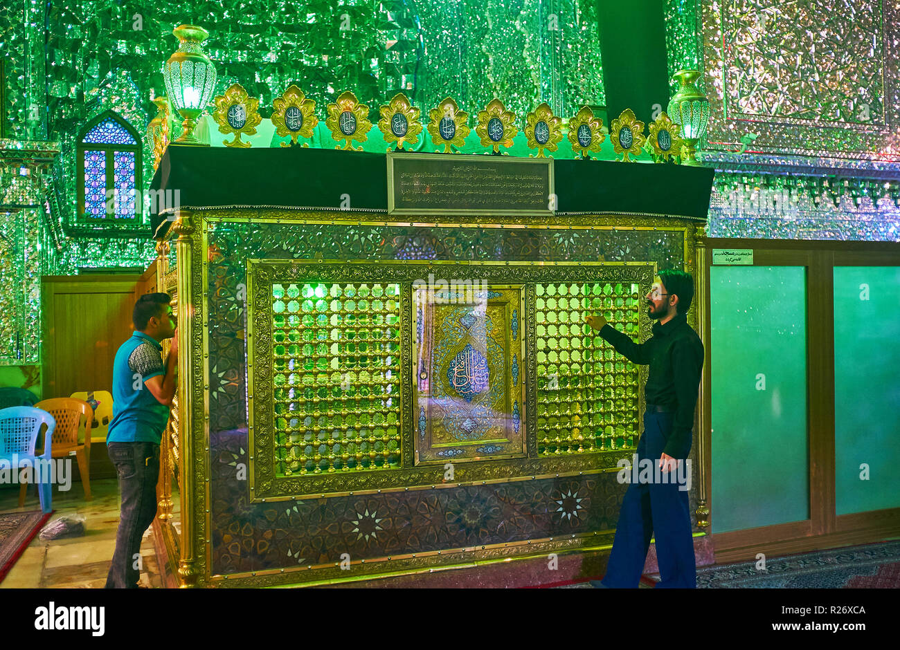 SHIRAZ, IRAN - OCTOBER 12, 2017: The muslim worshipers at the mausoleum ...