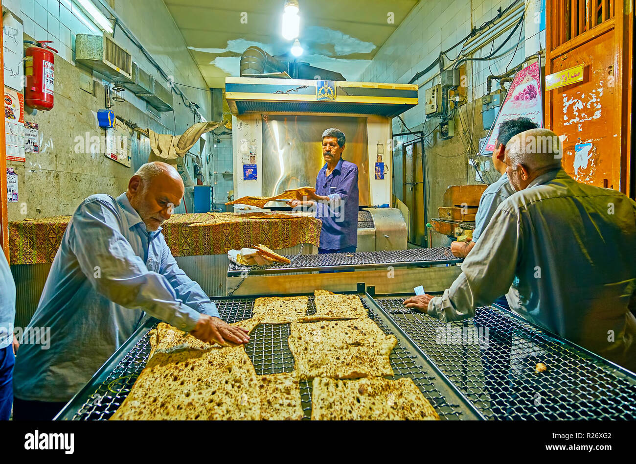 SHIRAZ, IRAN - OCTOBER 13, 2017: The old bakery works in the evening ...