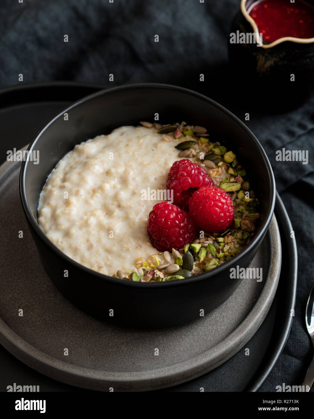 Porridge with raspberries and mixed seeds hi-res stock photography and ...
