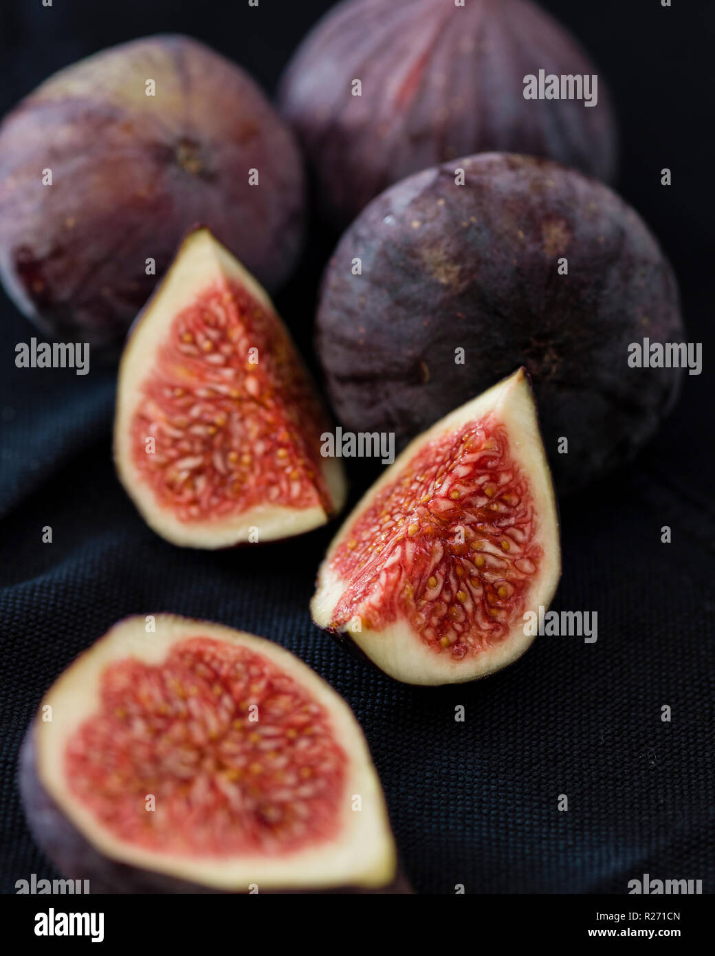 Figs on dark background Stock Photo - Alamy