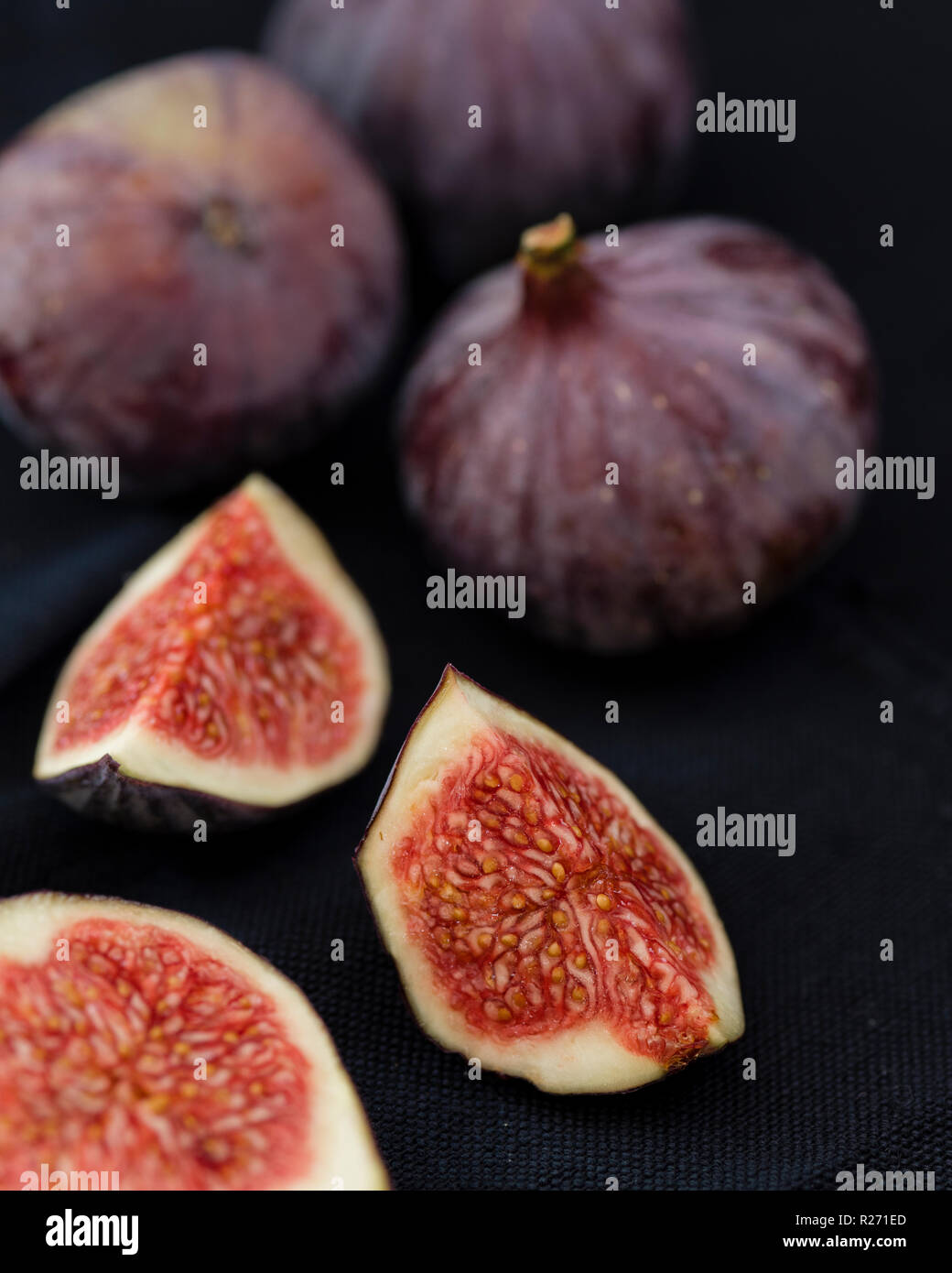 Figs on dark background Stock Photo - Alamy