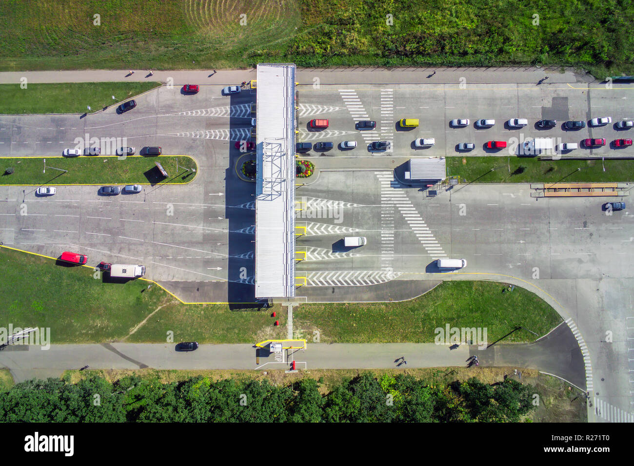 Aerial view of unpaved natural parking with lots of trucks, trailers ...