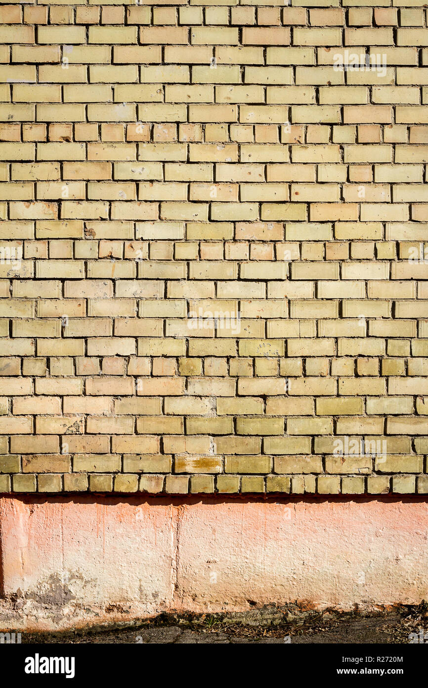 Yellow brick wall background with a ground Stock Photo - Alamy