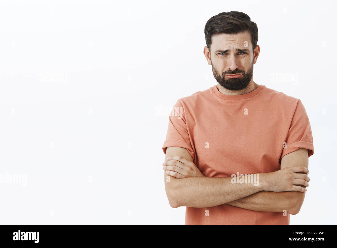 I thought you loved me. Crying bearded 30s guy frowning grimacing in ...