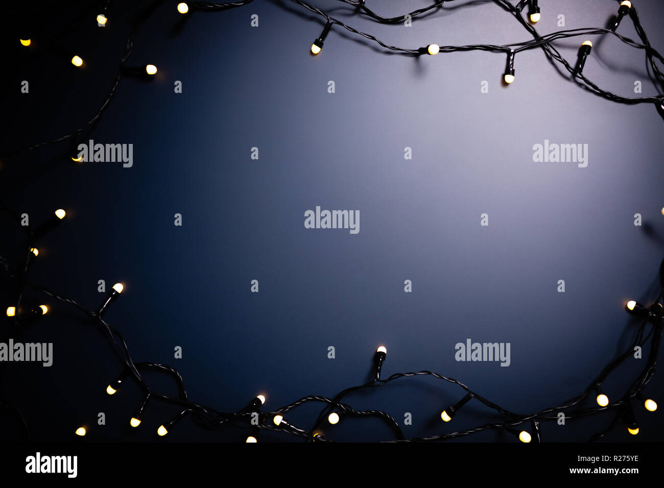Blue background surrounded by decorative lights Stock Photo - Alamy