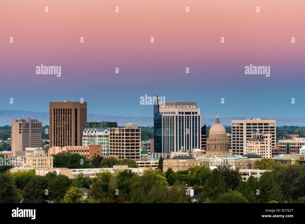 Warm colors in the sky over Boise Idaho as the sun begins to rise Stock ...