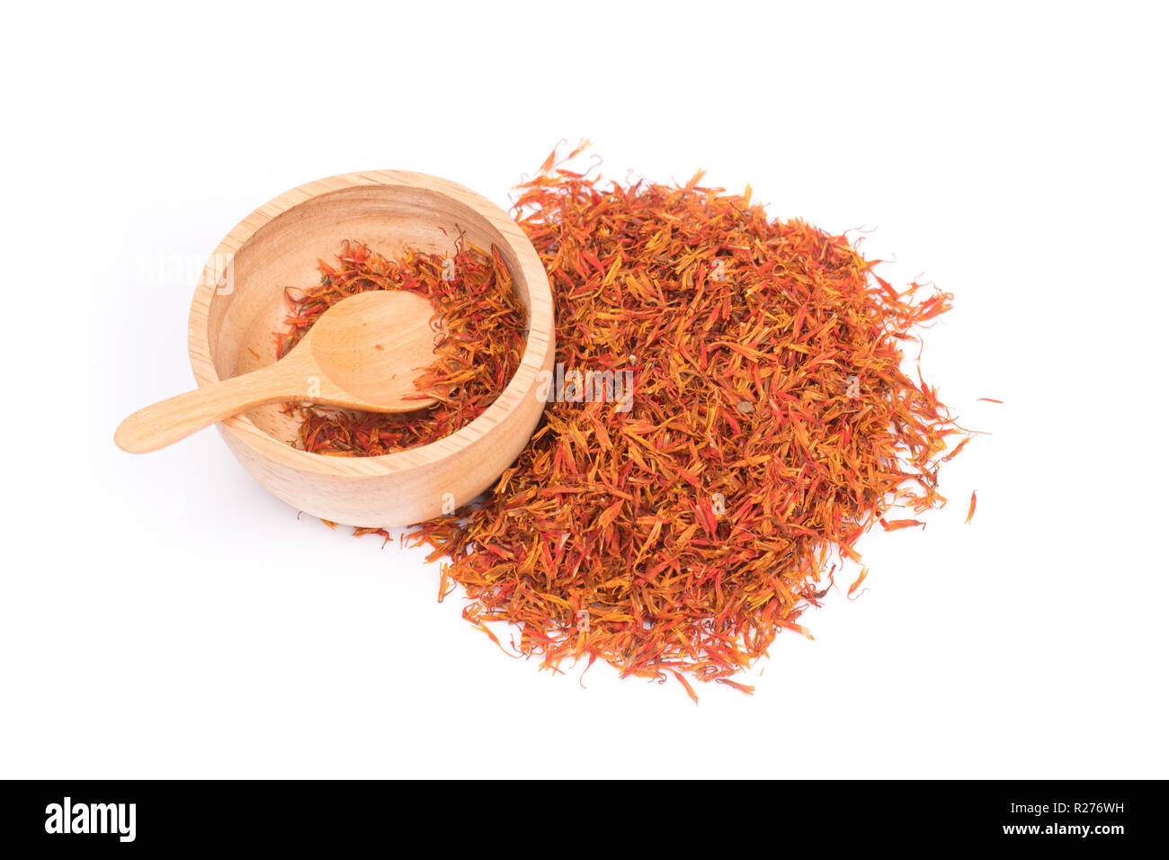 Dried safflower in wooden bowl isolated on white background Stock Photo ...