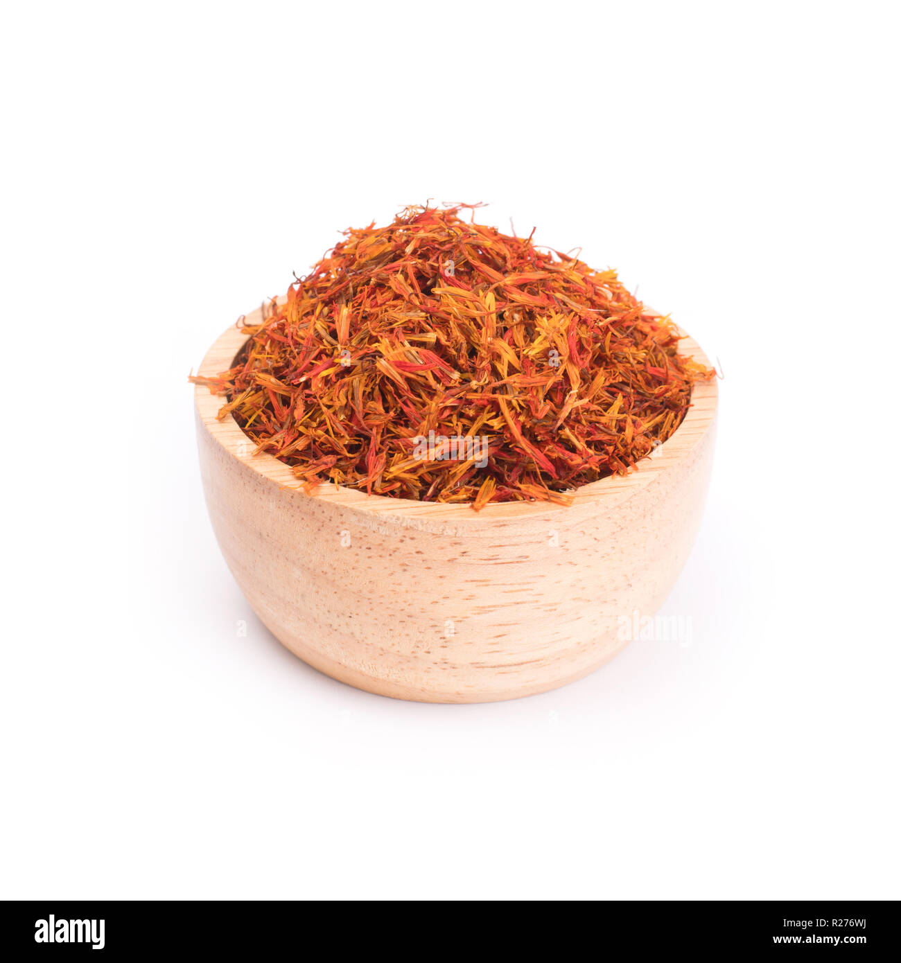 Dried safflower in wooden bowl isolated on white background Stock Photo ...