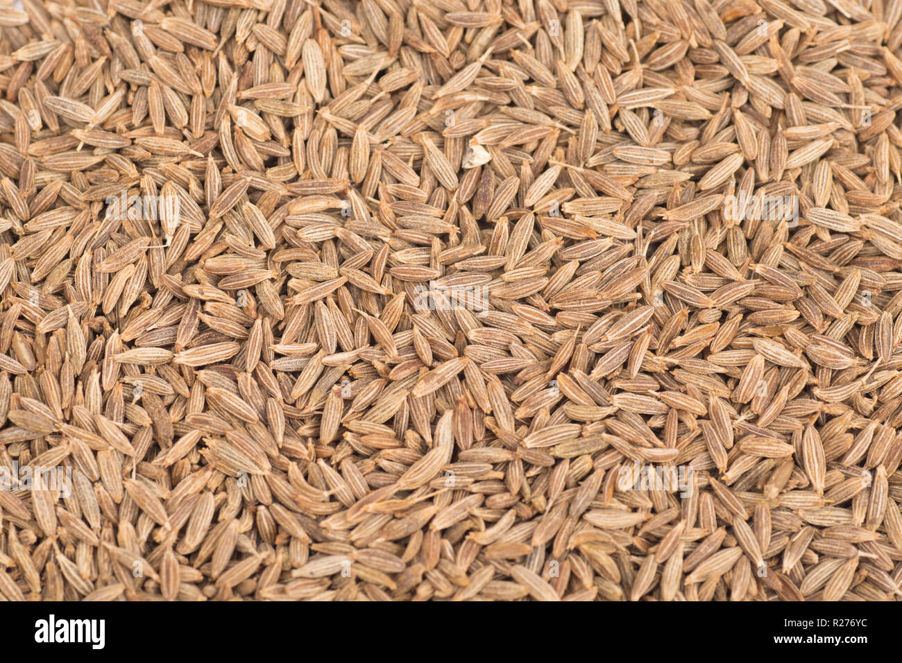 cumin seeds background Stock Photo - Alamy
