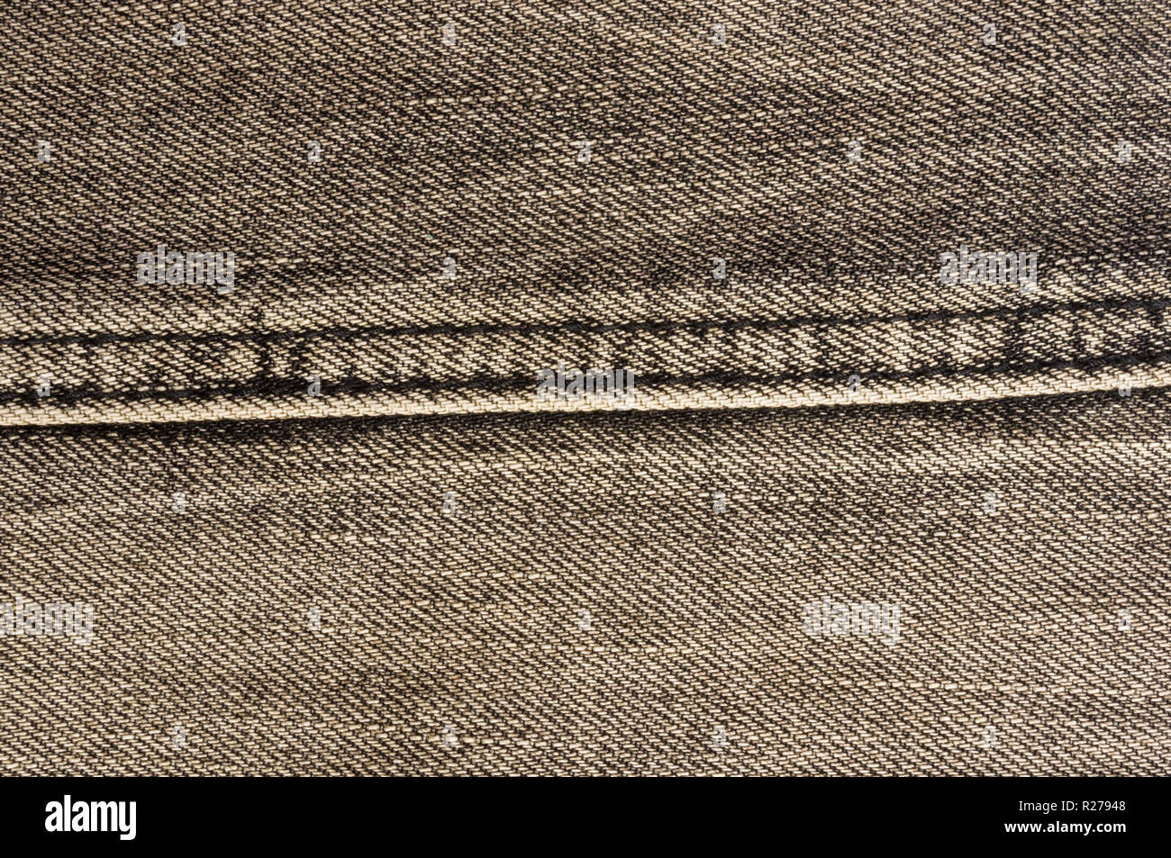 Black washed faded jeans texture with seams, clothing items, macro ...