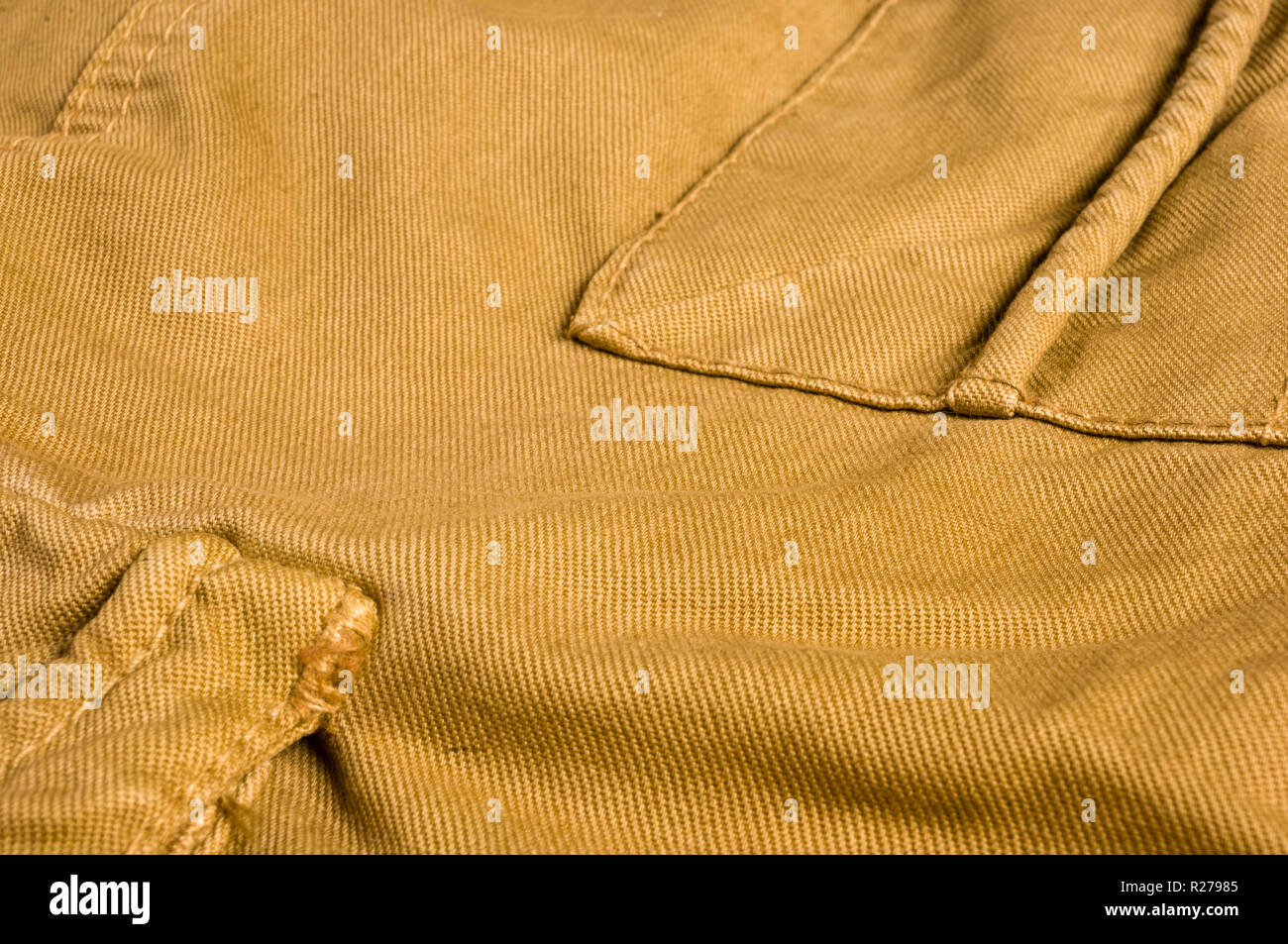 clothing items washed cotton fabric texture with seams, macro, close-up ...