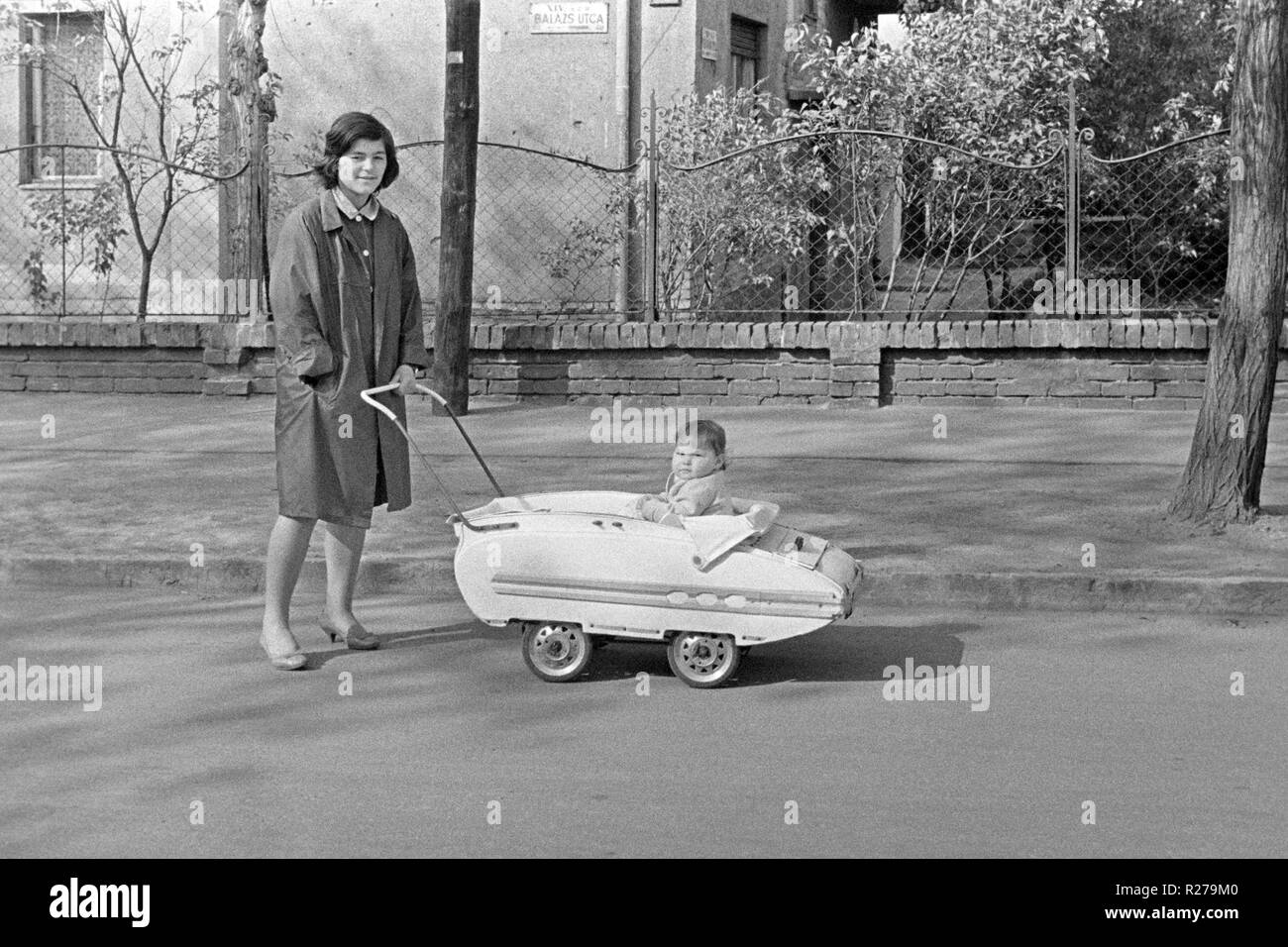 Woman pushing pram hi-res stock photography and images - Alamy