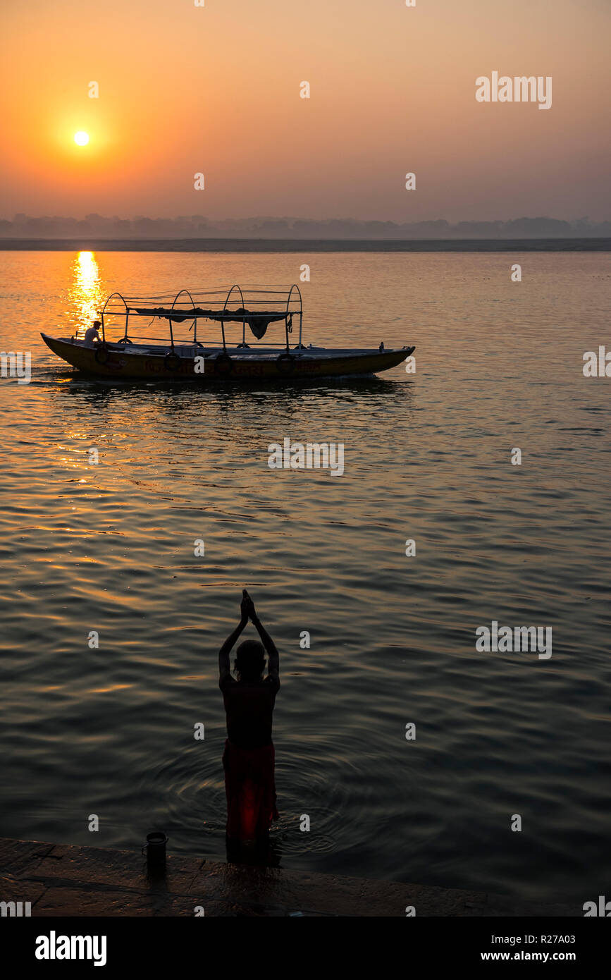 Morning ritual and washing at sunrise along the banks of the river ...
