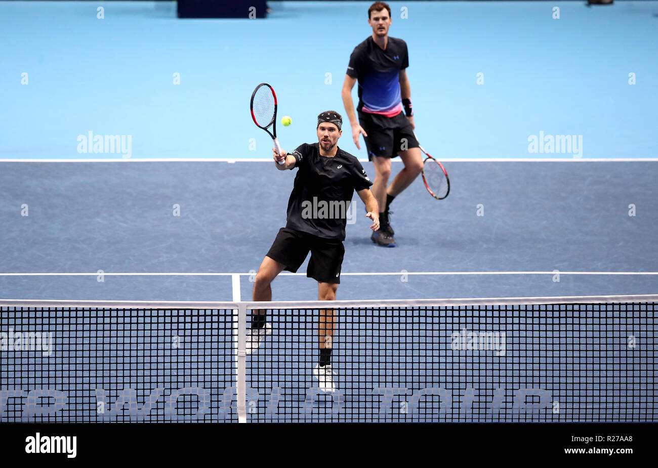 Bruno Soares (front) and Jamie Murray (back) in action during day seven ...