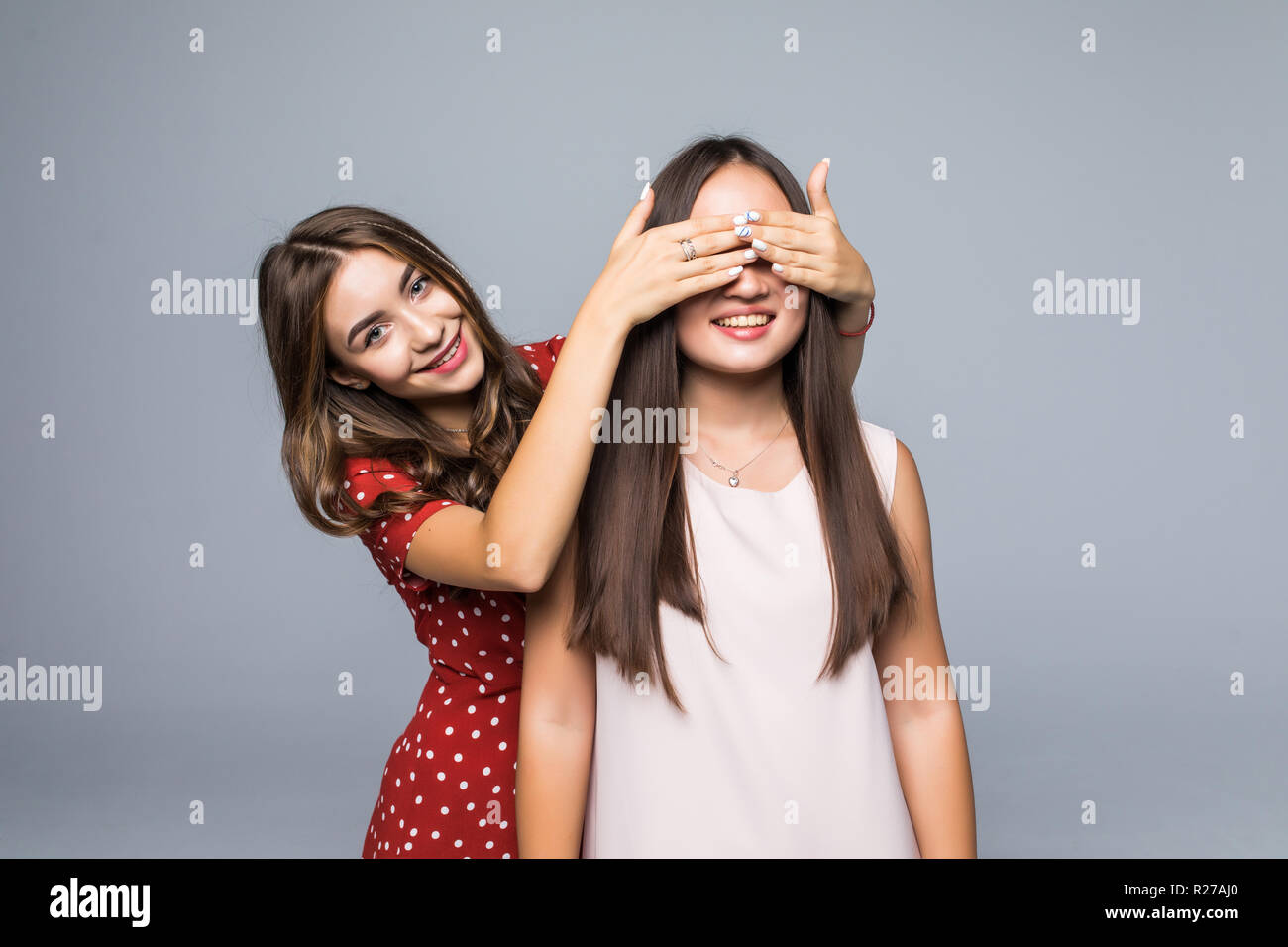 Girl laughing hands over mouth hi-res stock photography and images - Alamy