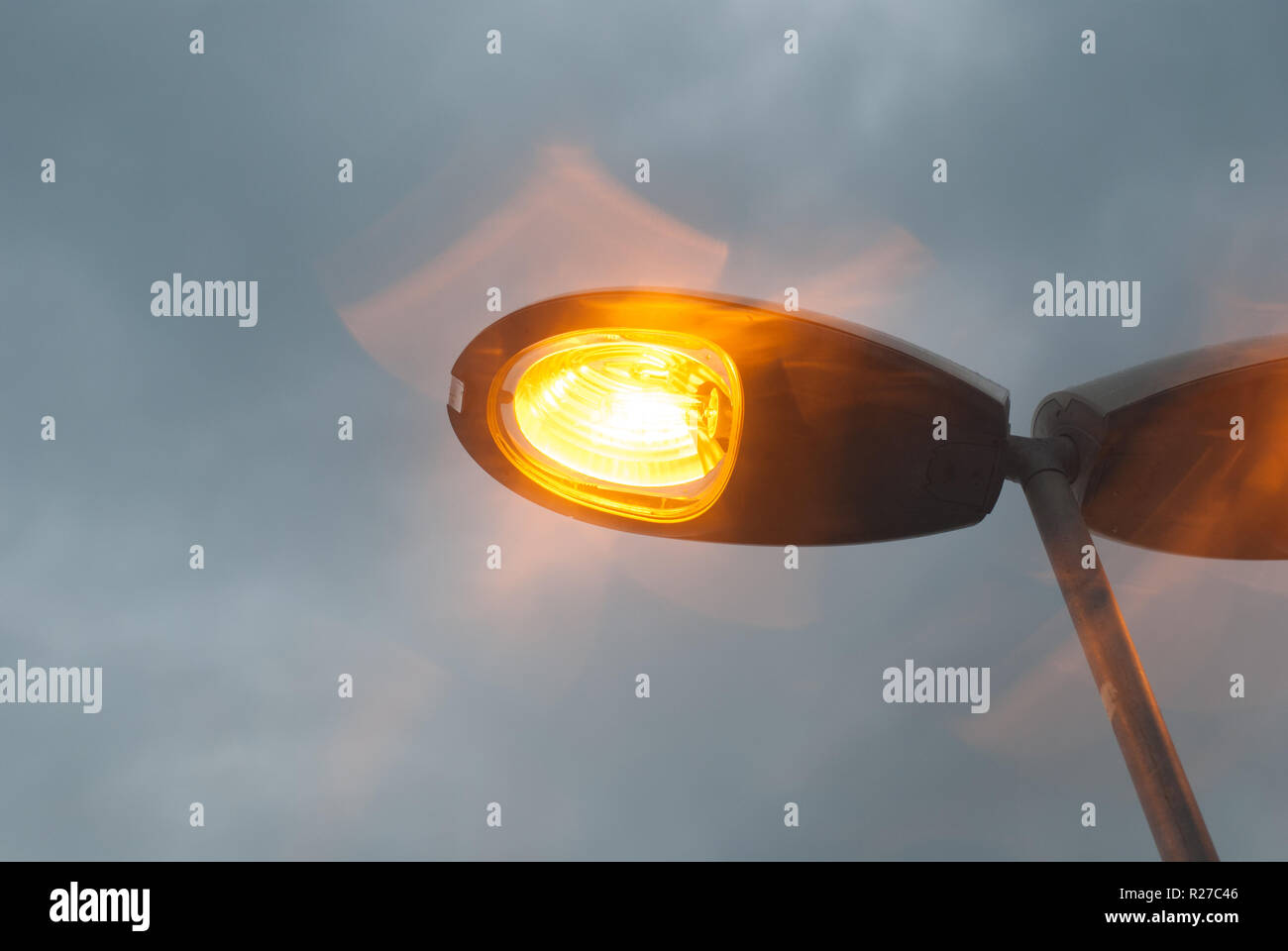 Luminous yellow street lamp through the window Stock Photo - Alamy