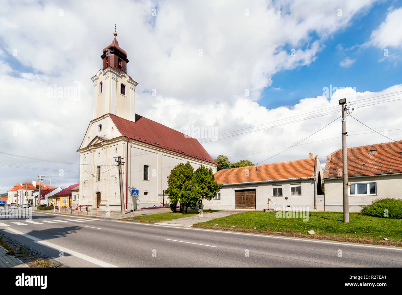 Clouds over church in Trstin - a village in Slovakia Stock Photo - Alamy