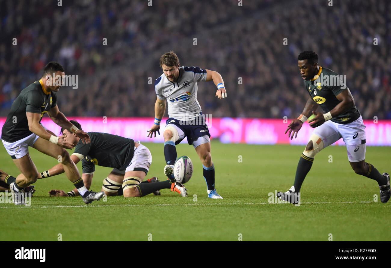 Scotland's Peter Horne hacks the ball on with Jesse Kriel and Siya ...