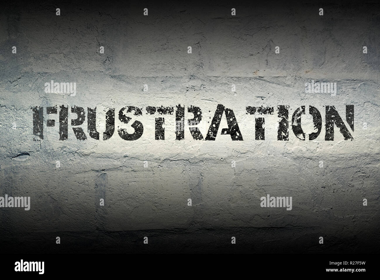 frustration stencil print on the grunge white brick wall Stock Photo ...