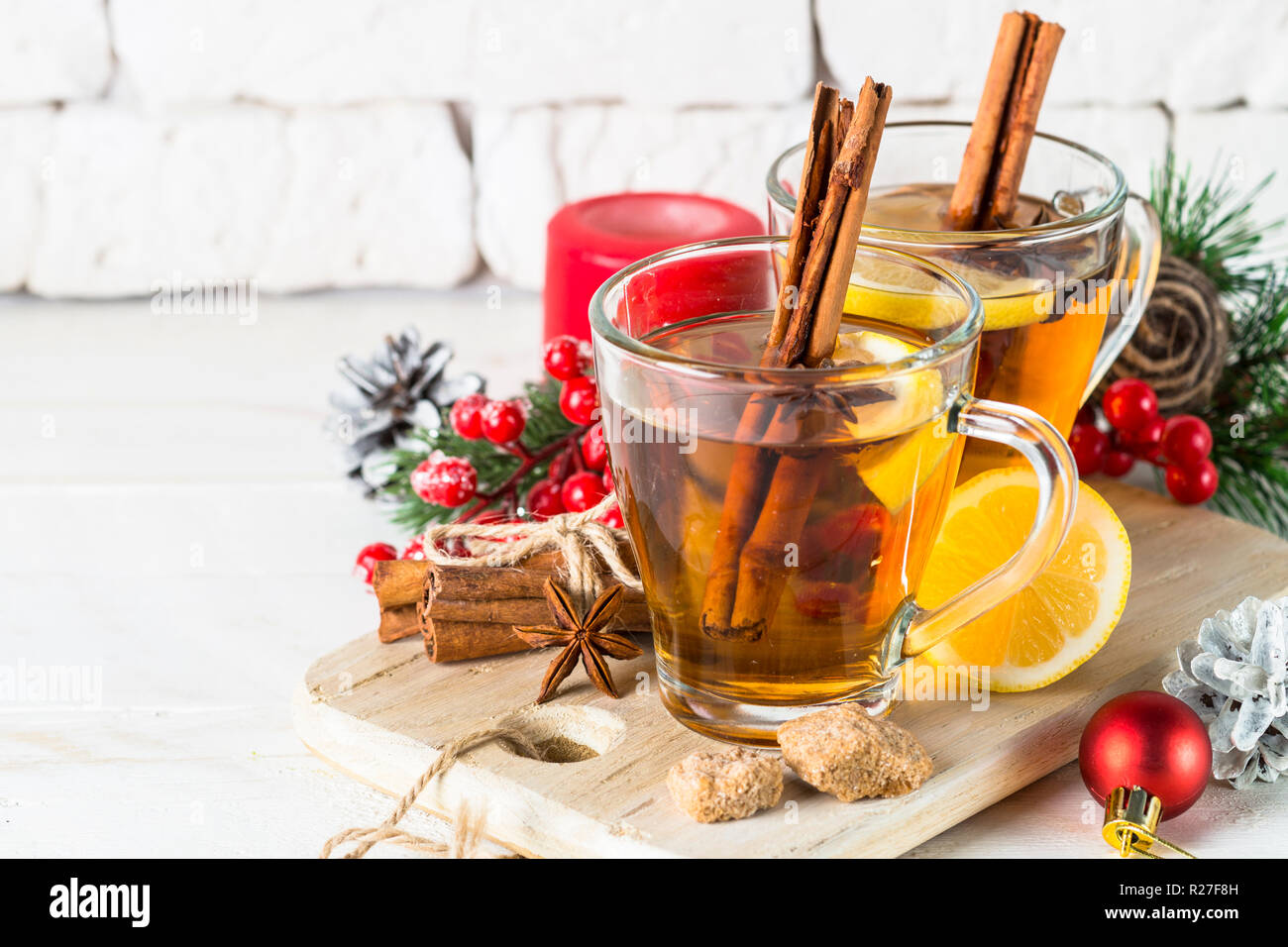 Christmas hot tea with lemon, spices and decorations Stock Photo - Alamy