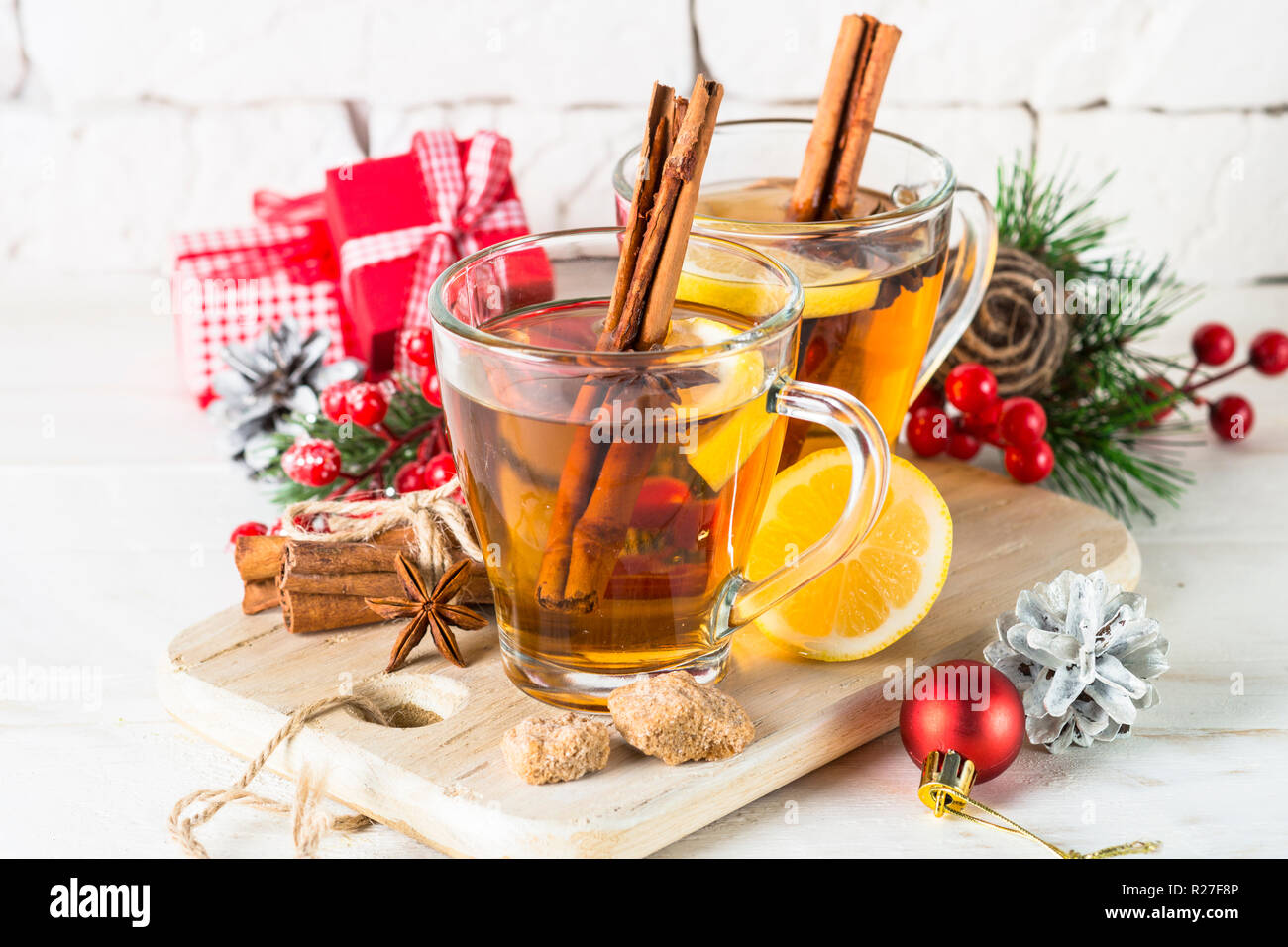 Christmas hot tea with lemon, spices and decorations Stock Photo - Alamy
