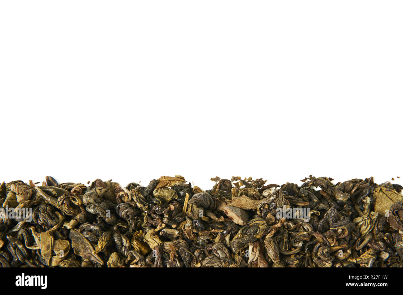 A pile of dry green tea. Isolated on white background Stock Photo - Alamy