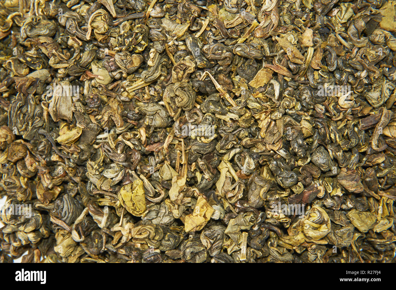 A pile of dry green tea. Isolated on white background Stock Photo - Alamy