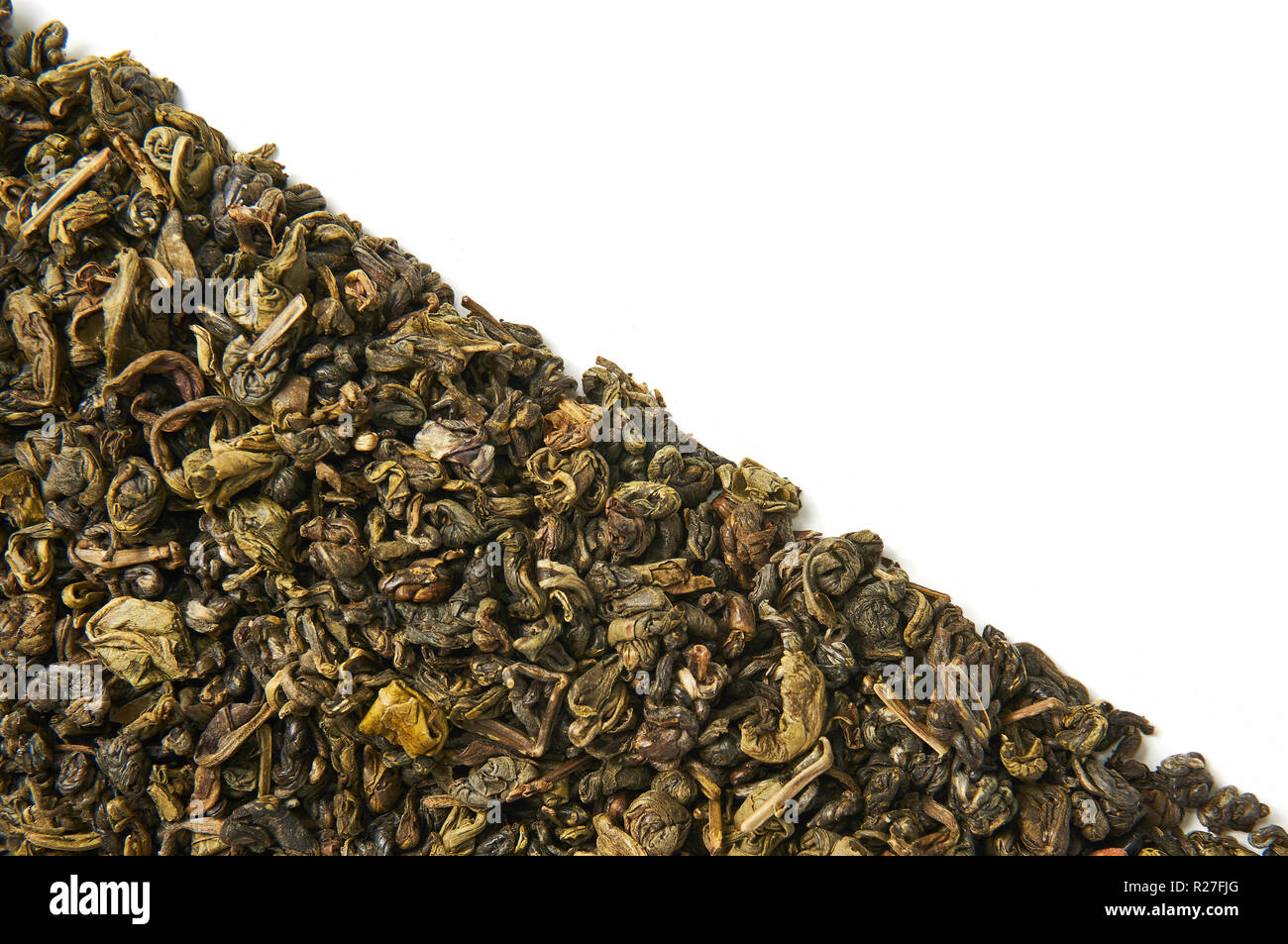 A pile of dry green tea. Isolated on white background Stock Photo - Alamy