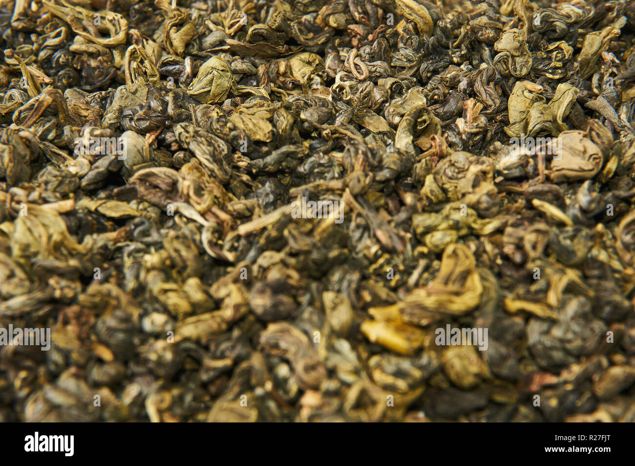 A pile of dry green tea. Isolated on white background Stock Photo - Alamy