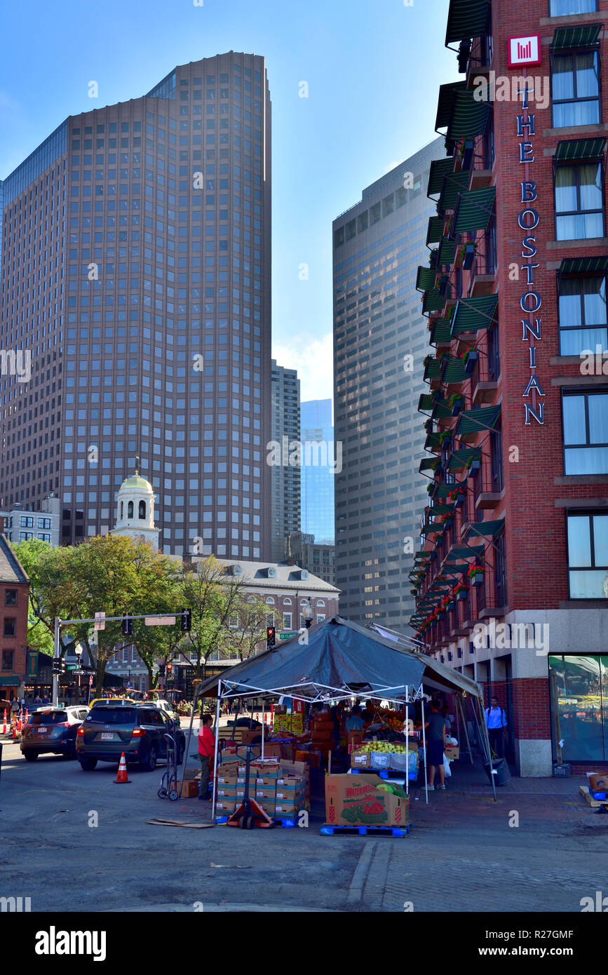 Boston street market with fresh vegetables and fruits and city skyline ...