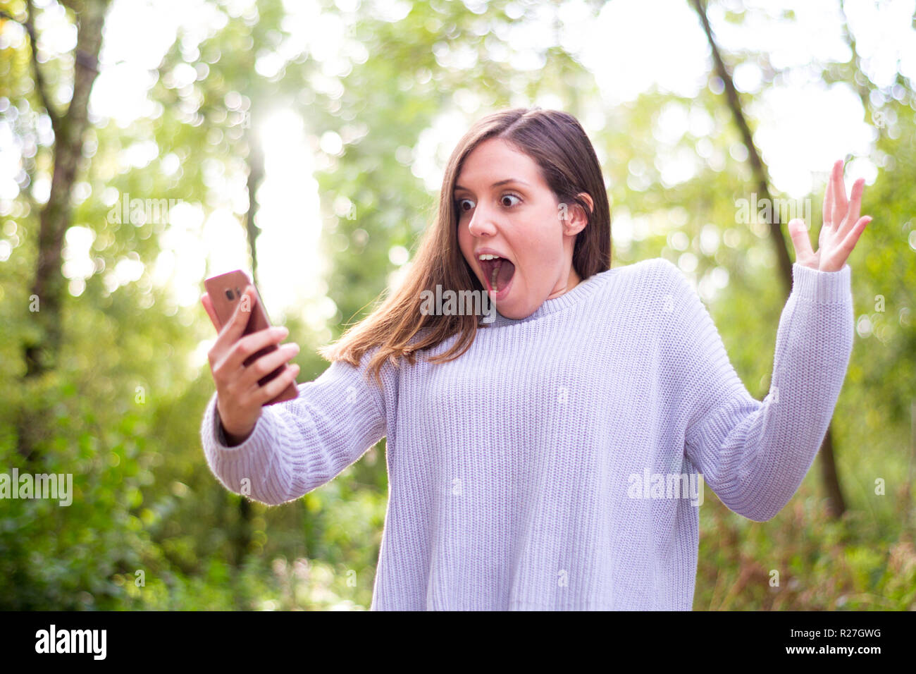 Young brunette caucasian girl hallucinating and surprised of the ...