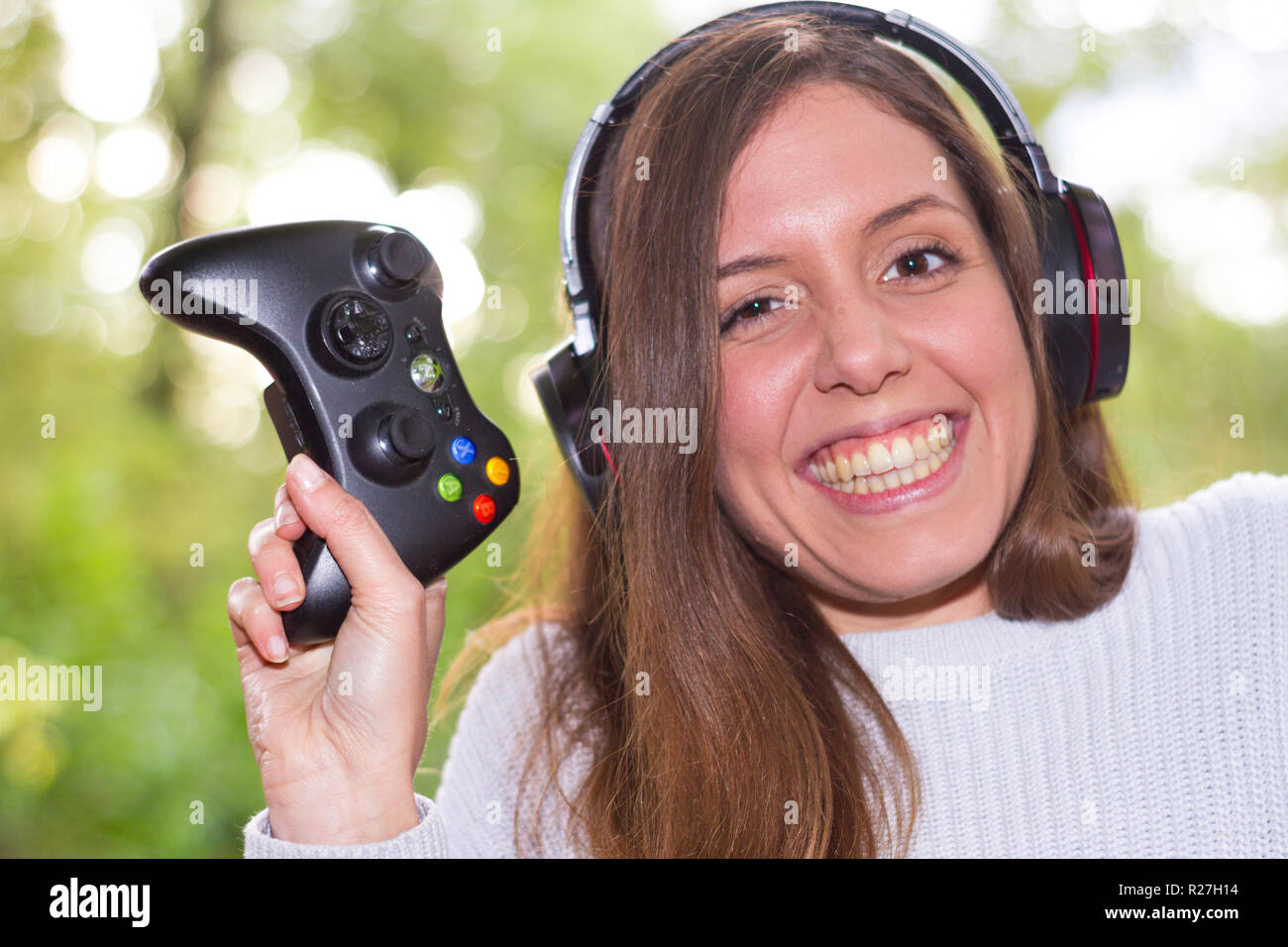 Woman or young European Caucasian girl with helmets and remote control ...