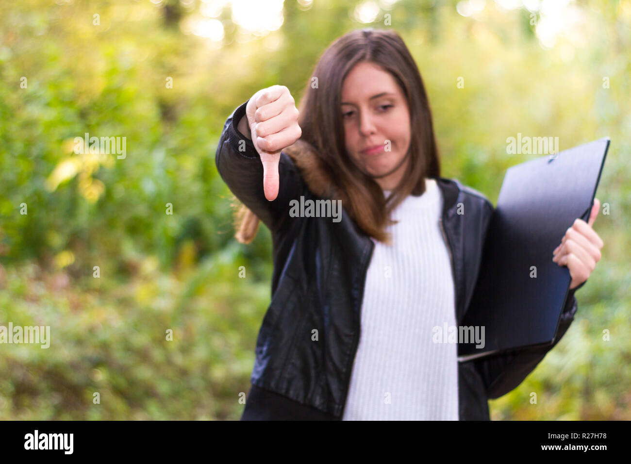 Woman or young caucasian european college girl or student with folder ...