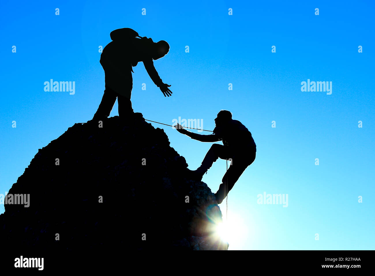 Mountain climbers helping hi-res stock photography and images - Alamy