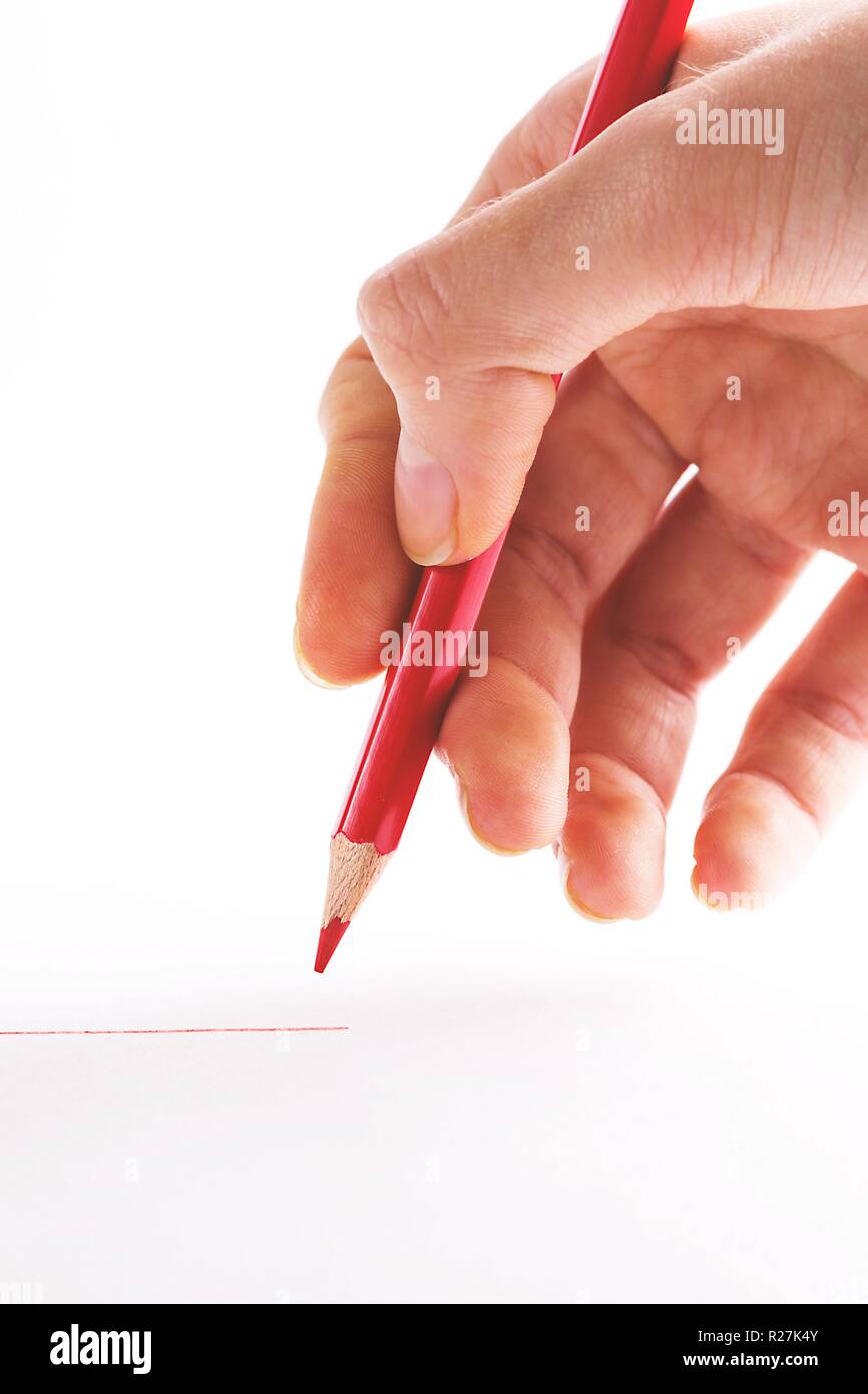 hand with the red pencil on a white background Stock Photo - Alamy