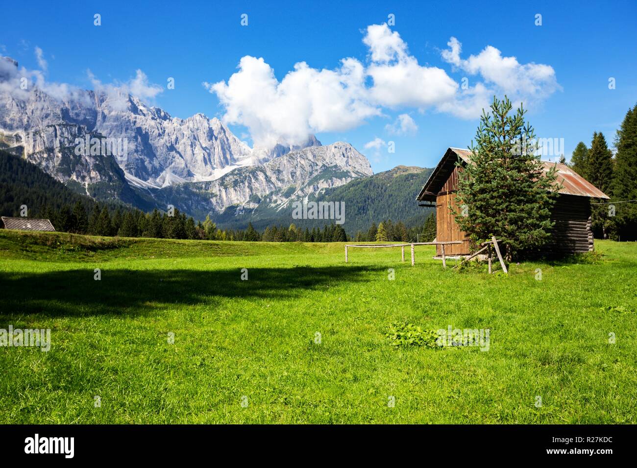 beautiful landscape and small wooden house in the mountains. Dolomites ...