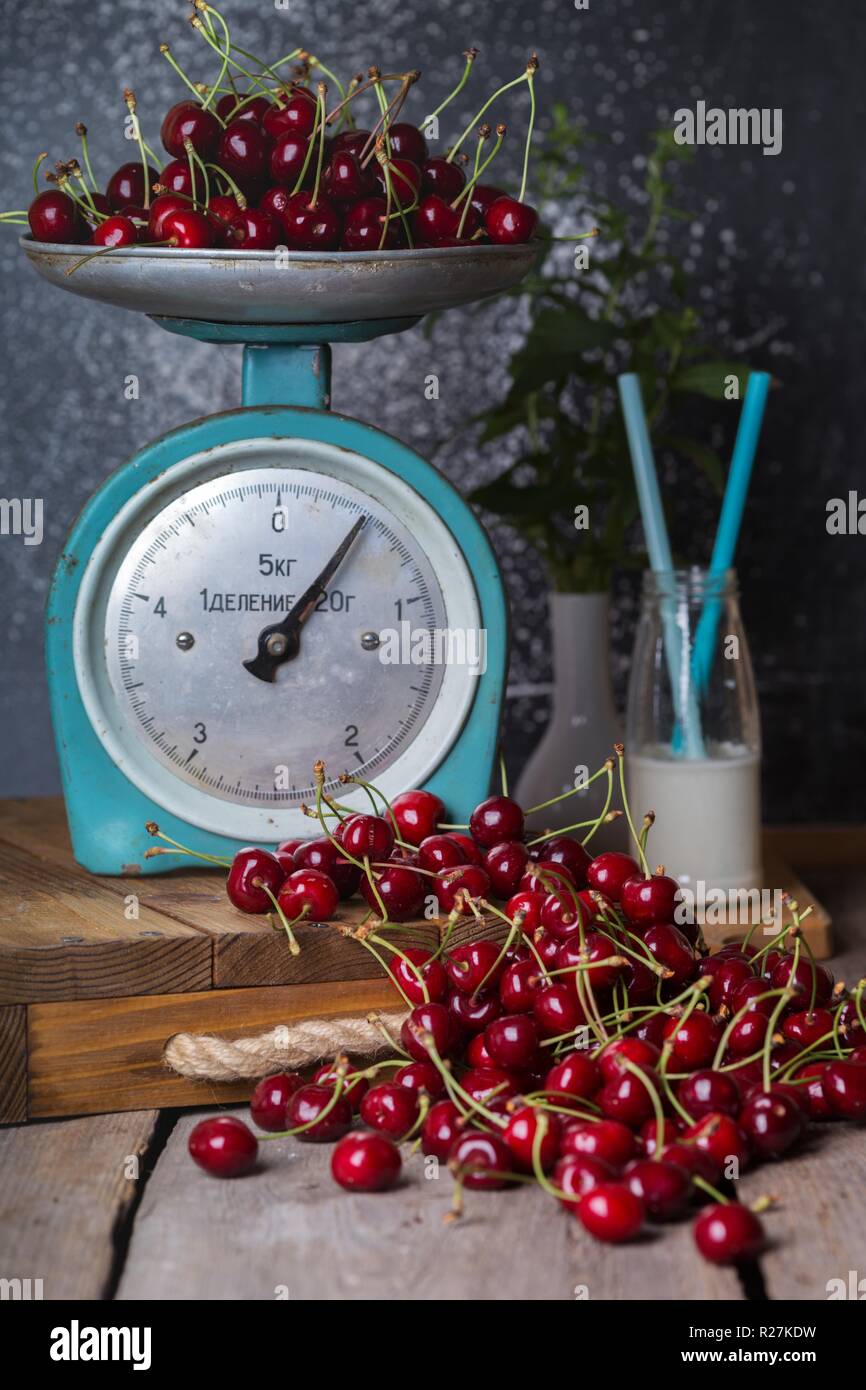 shot in vintage style - red cherry and old vintage scales Stock Photo ...