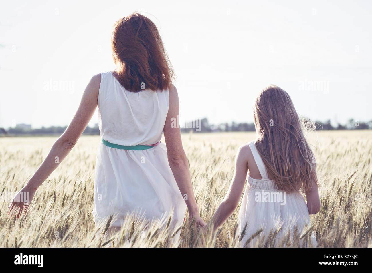 happy summer and vacation. Family - mother with her daughter in a wheat ...