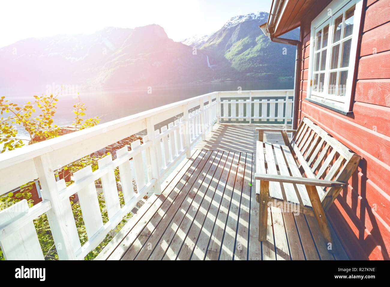 bench for rest at the norwegian terrace house with mountains and a ...