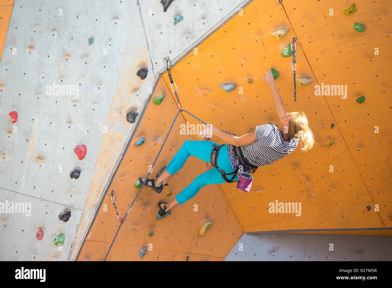 bouldering, girl climbing up the wall Stock Photo - Alamy