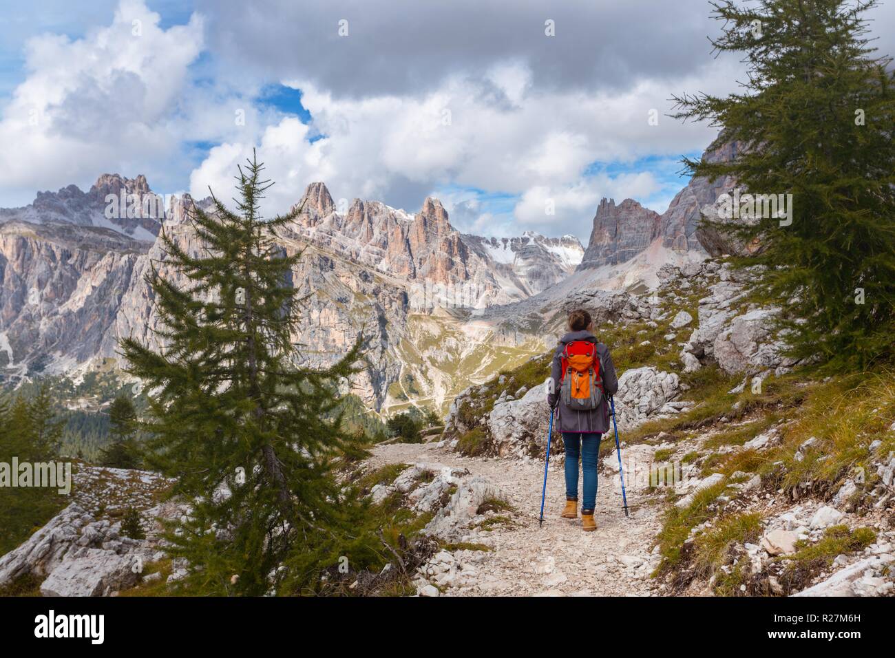 girl hiker at the mountains Dolomites, Italy. Cinque Torri Stock Photo ...