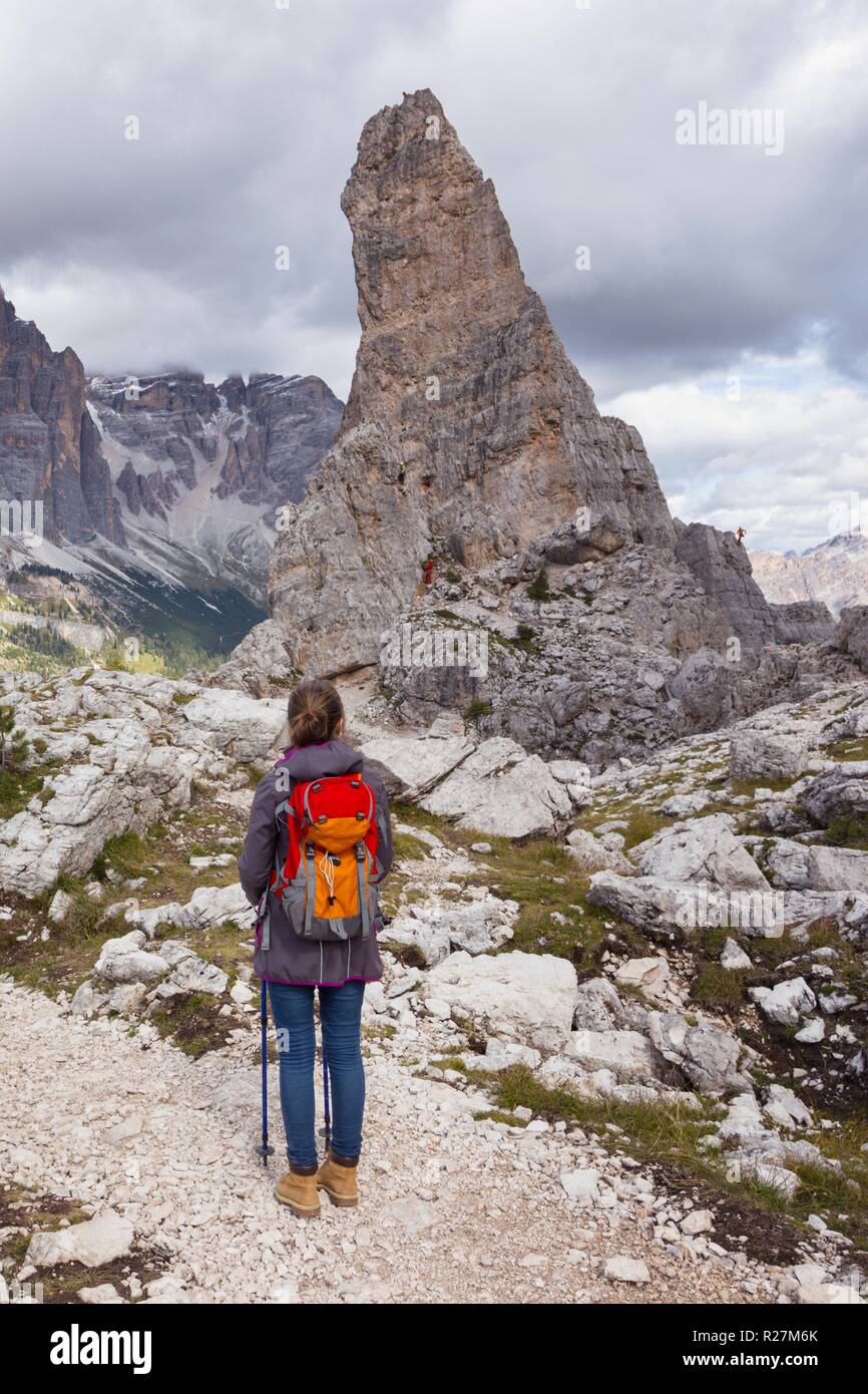 girl hiker at the mountains Dolomites, Italy. Cinque Torri Stock Photo ...