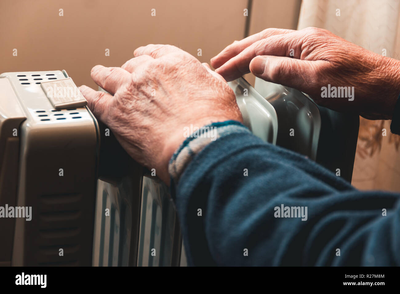 Elderly and bill and heater hi-res stock photography and images - Alamy
